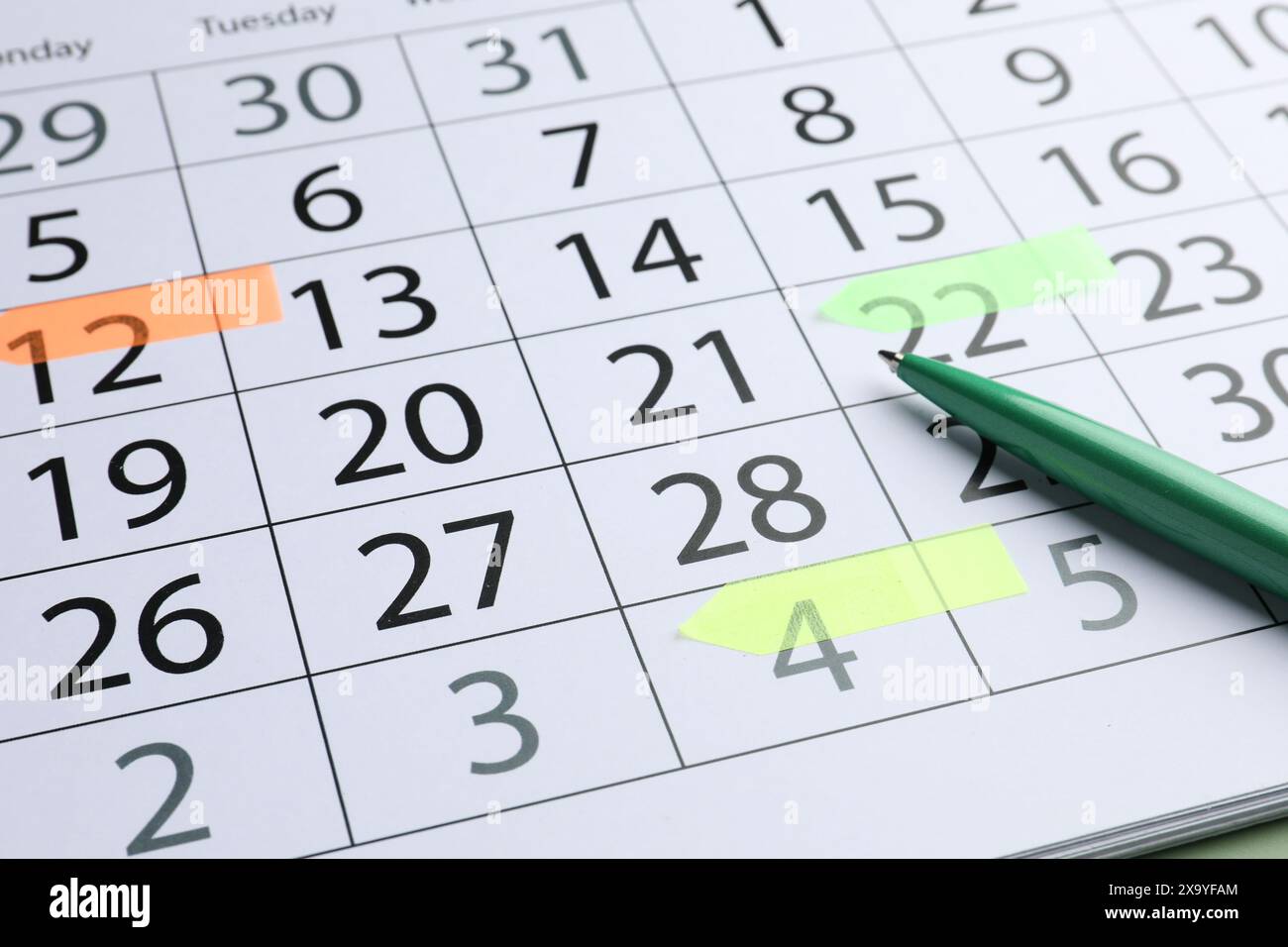 Timetable. Calendar page with marked dates and pen, closeup Stock Photo ...
