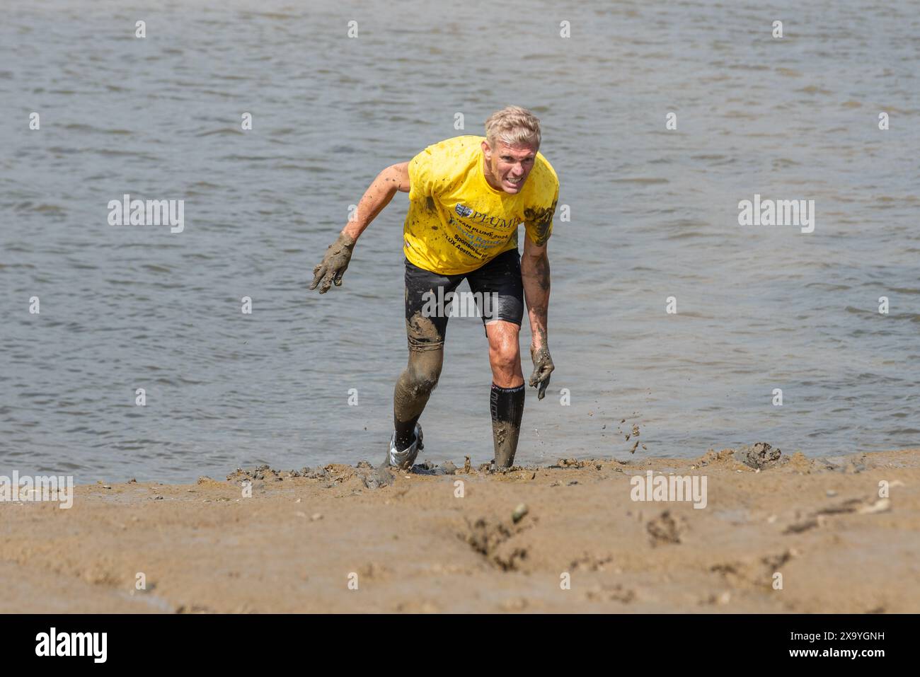Peter Carlsson, winning runner in the Maldon Mud Race in Maldon, Essex ...