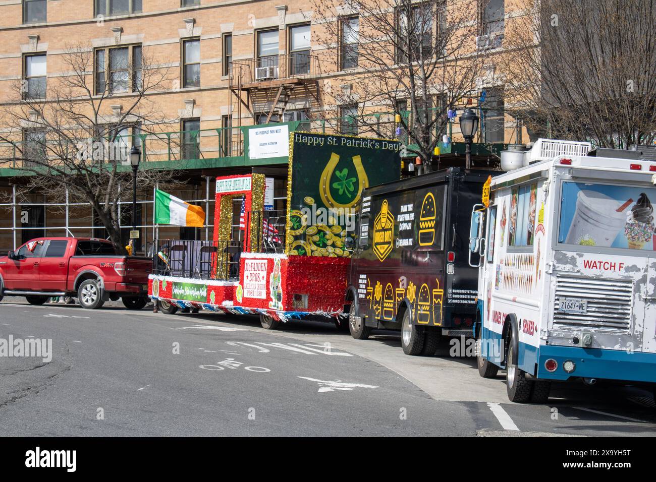 A colorful parade truck is parked on the roadside. St. Patrick's Day ...