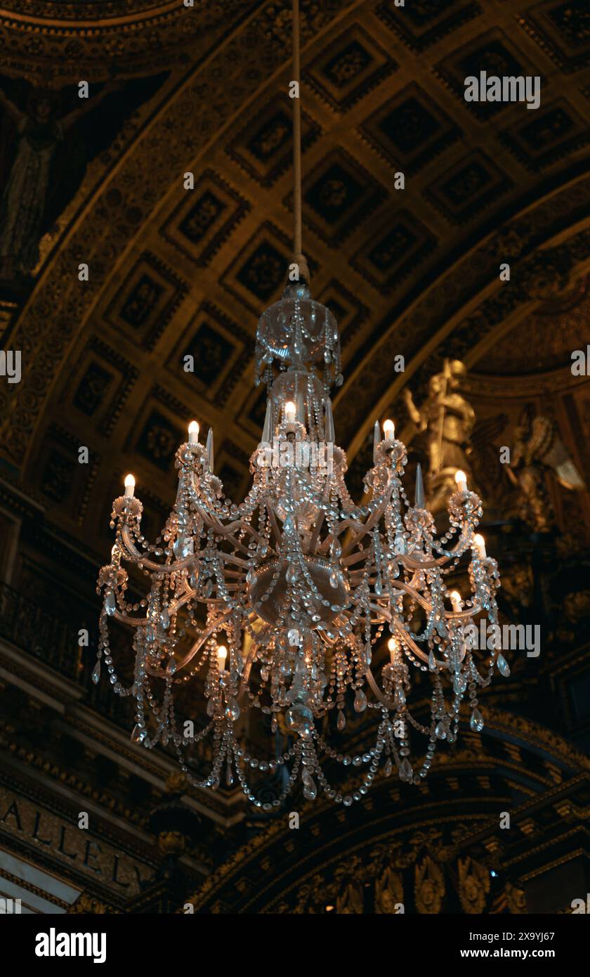 Elegant chandelier with candles inside a building Stock Photo - Alamy