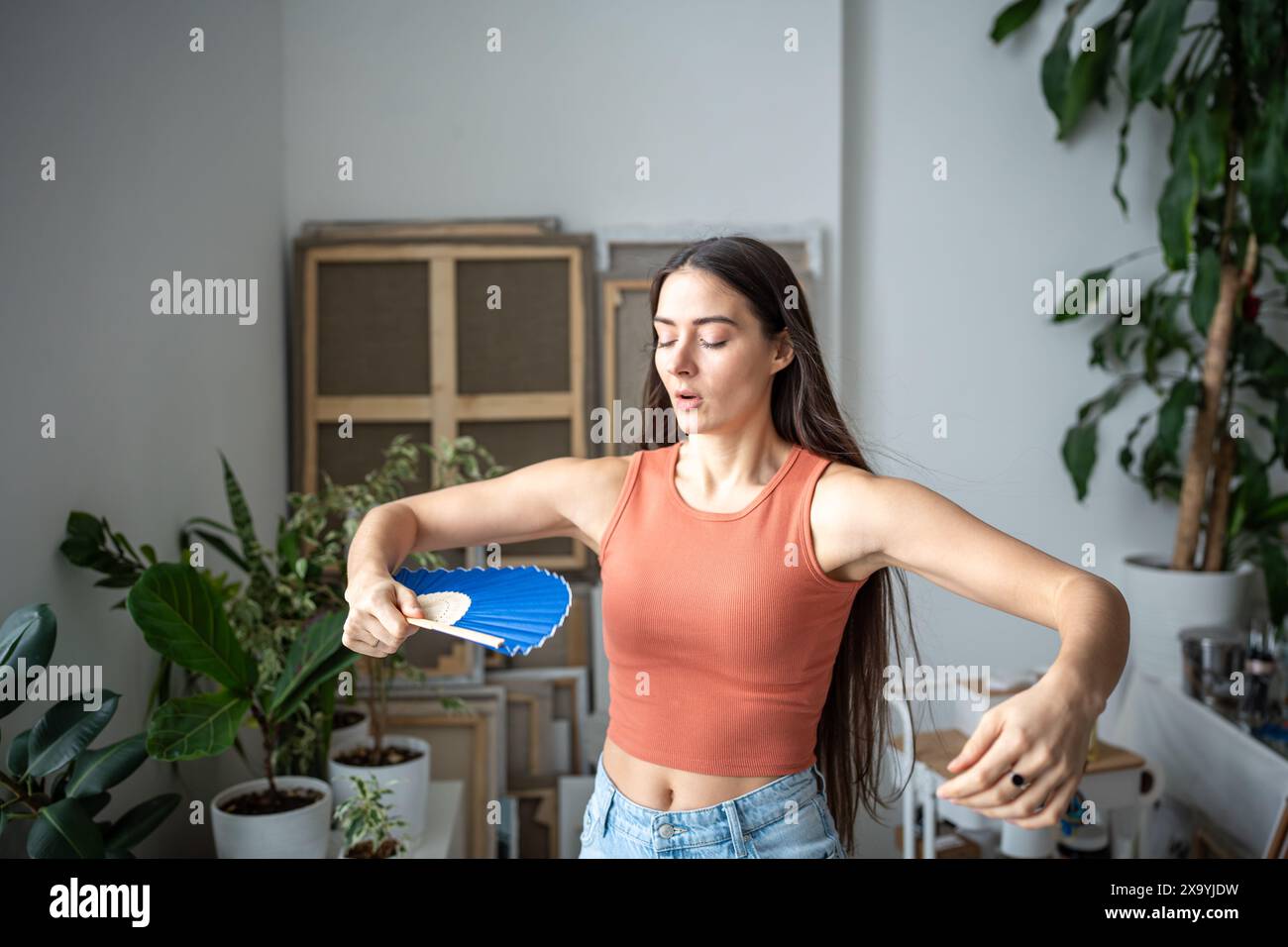 Unhappy sweaty woman experiencing discomfort from abnormal summer heat ...