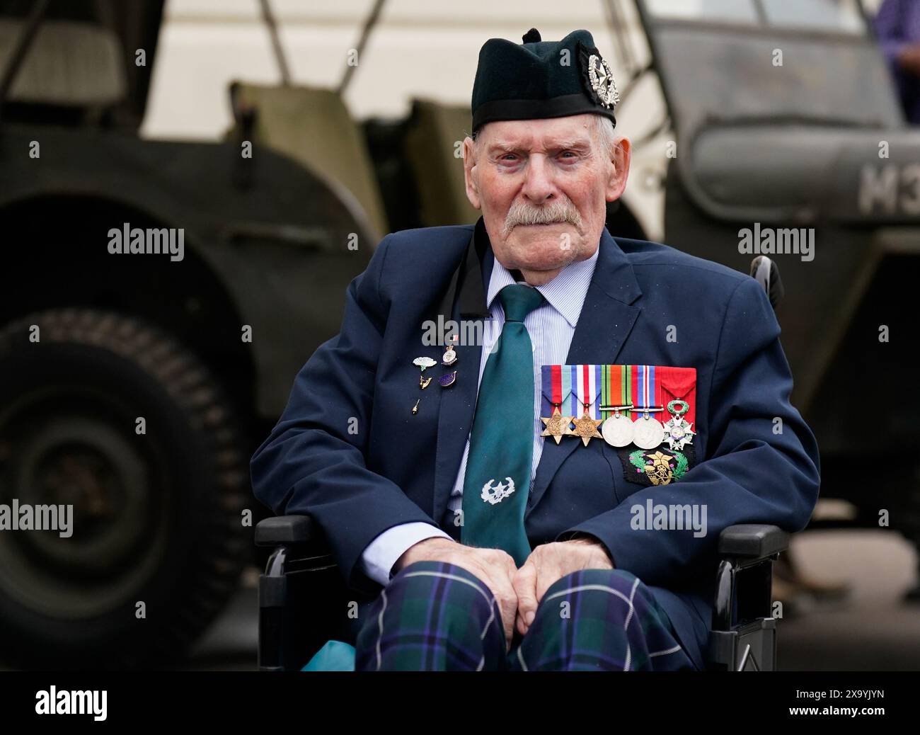 Normandy veteran Donald Tuttell, 98, poses for a photograph during an ...