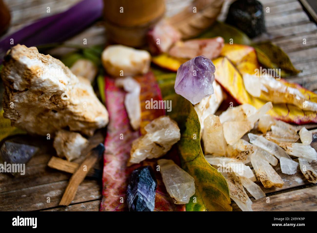 Various gemstones and crystals displayed on a plate atop a table Stock ...