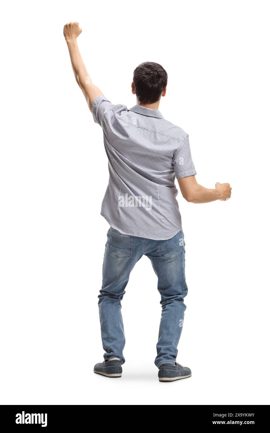Rear view shot of a happy young man with arms up isolated on white ...
