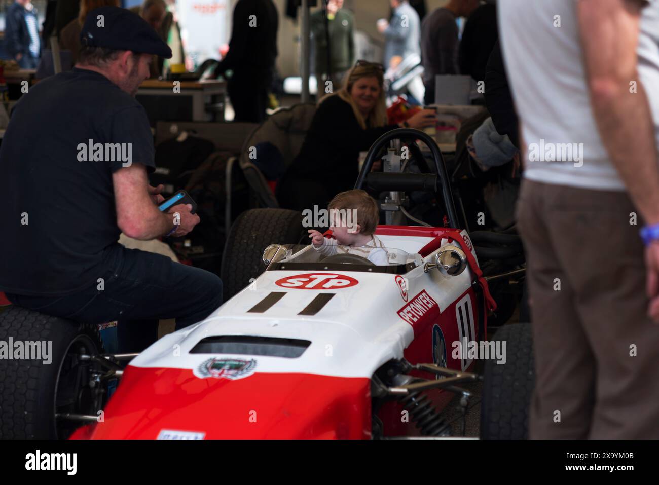 Young toddler in the seat of a 1970 March Ford 703 at the 81st Members ...