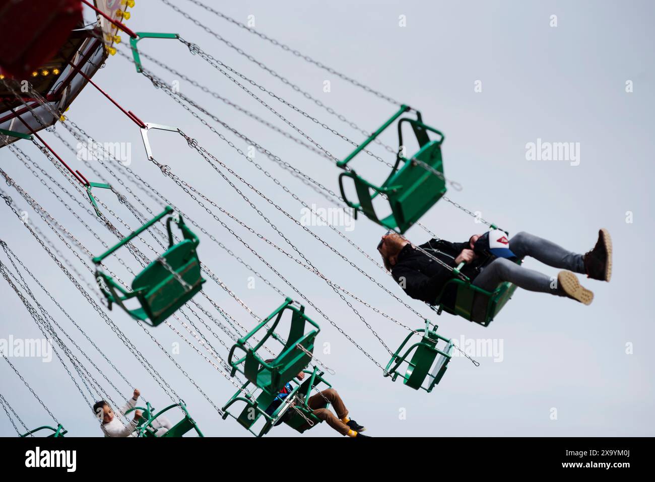 People on the Chair-o-planes at the funfair at the 81st Members ...
