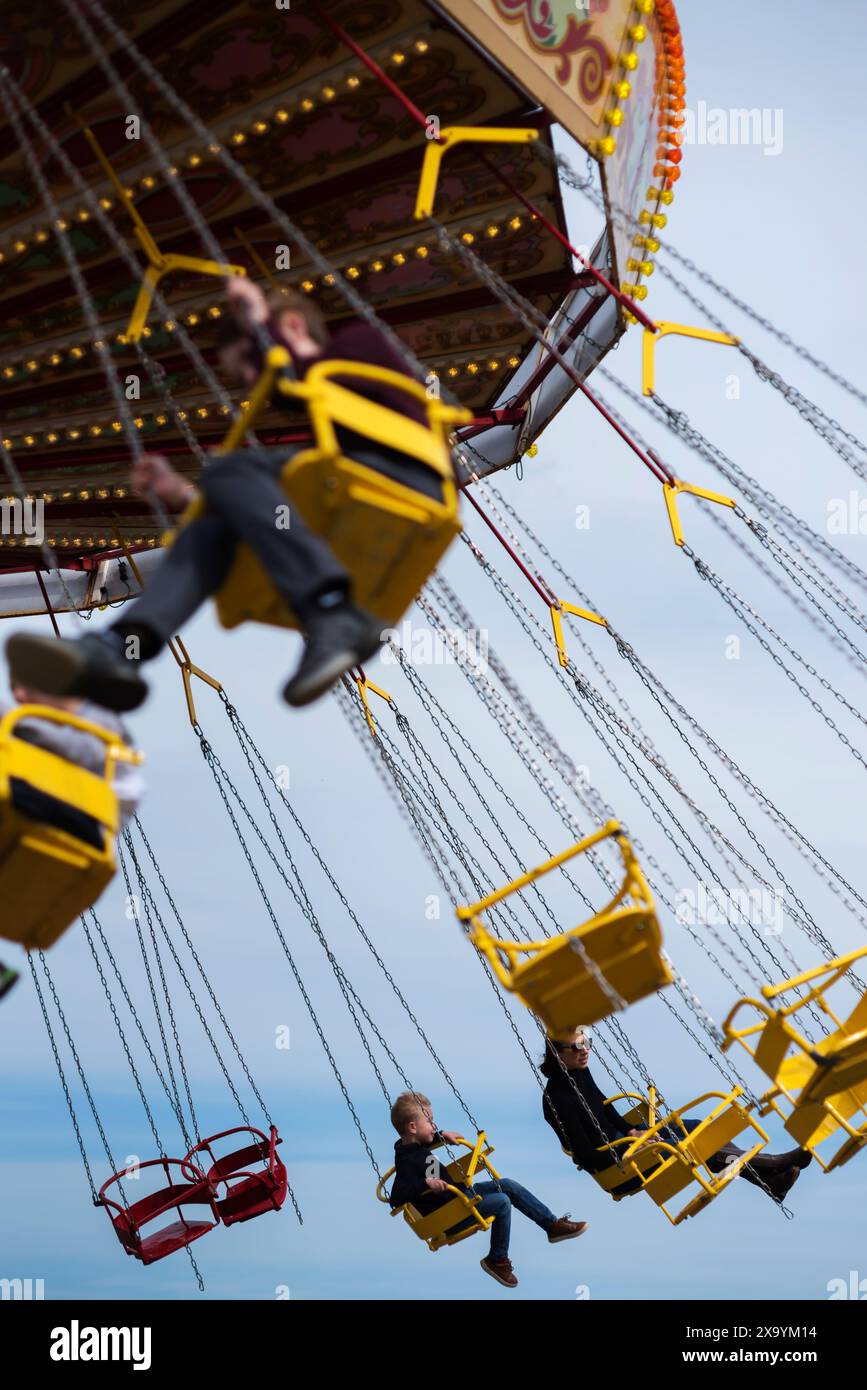 People on the Chair-o-planes at the funfair at the 81st Members ...