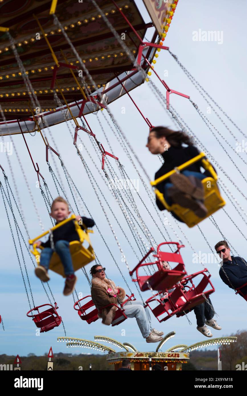 People on the Chair-o-planes at the funfair at the 81st Members ...