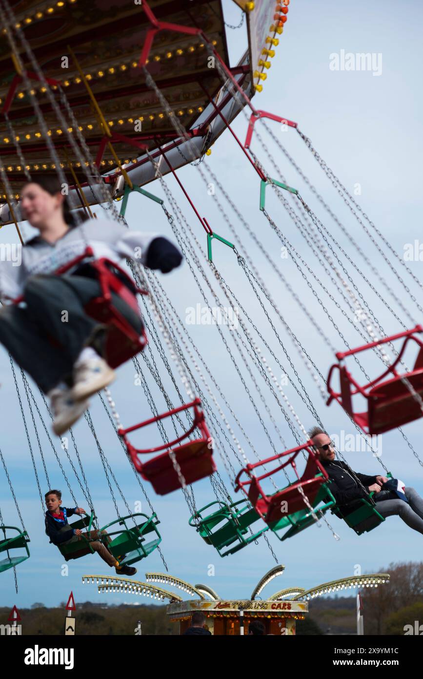 People on the Chair-o-planes at the funfair at the 81st Members ...