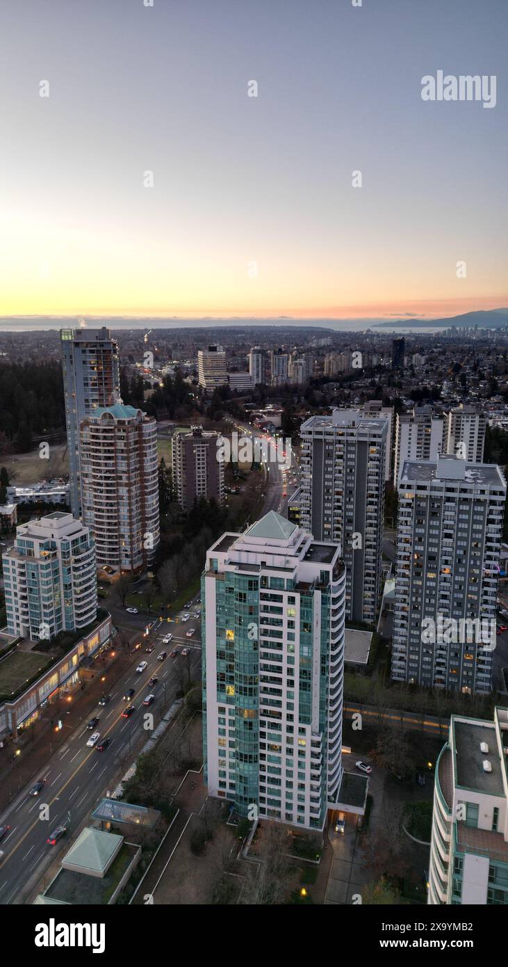 Cityscape with distant skyscrapers and passing cars Stock Photo - Alamy
