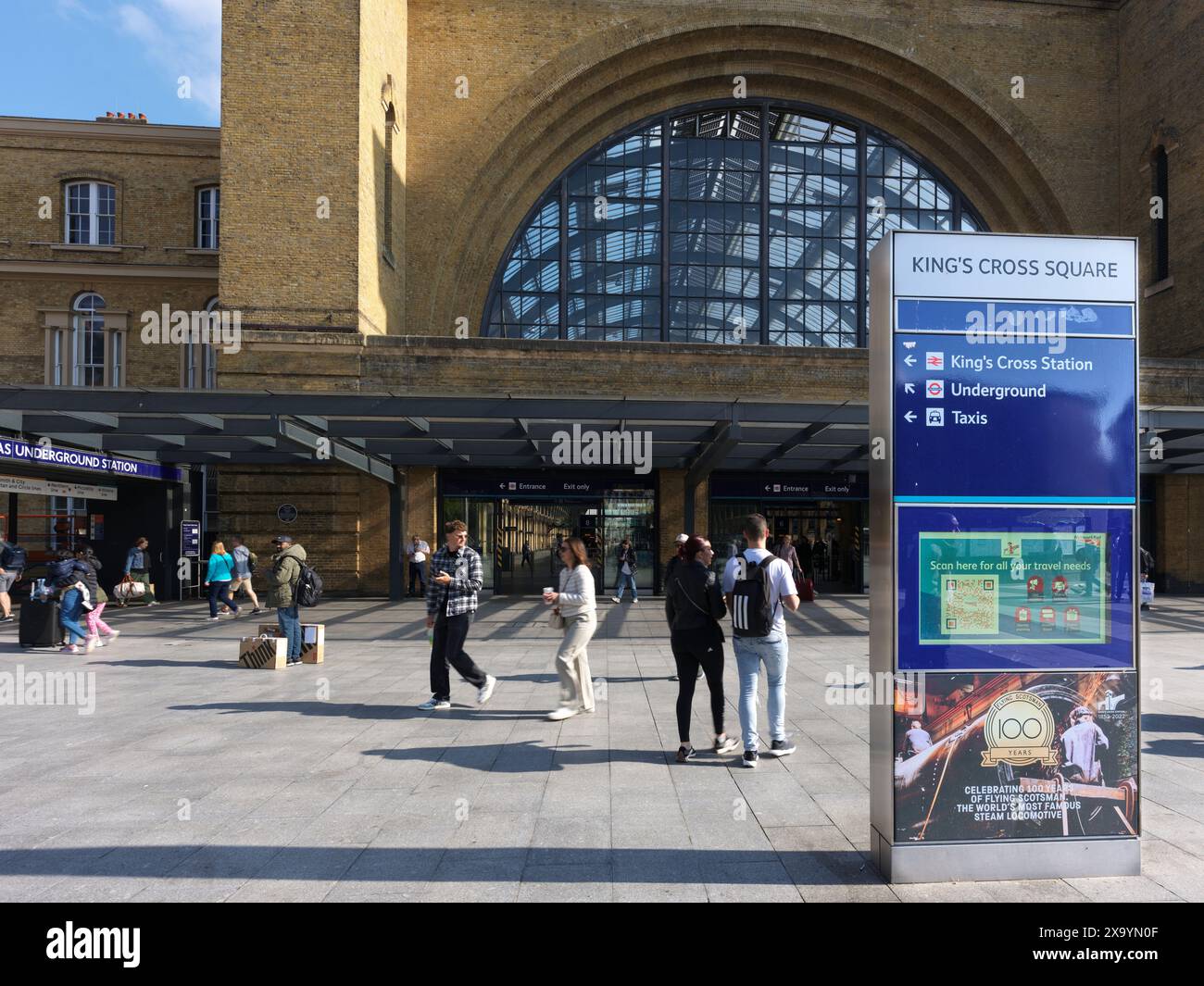 Travellers outside King's Cross railway station at King's Cross Square ...