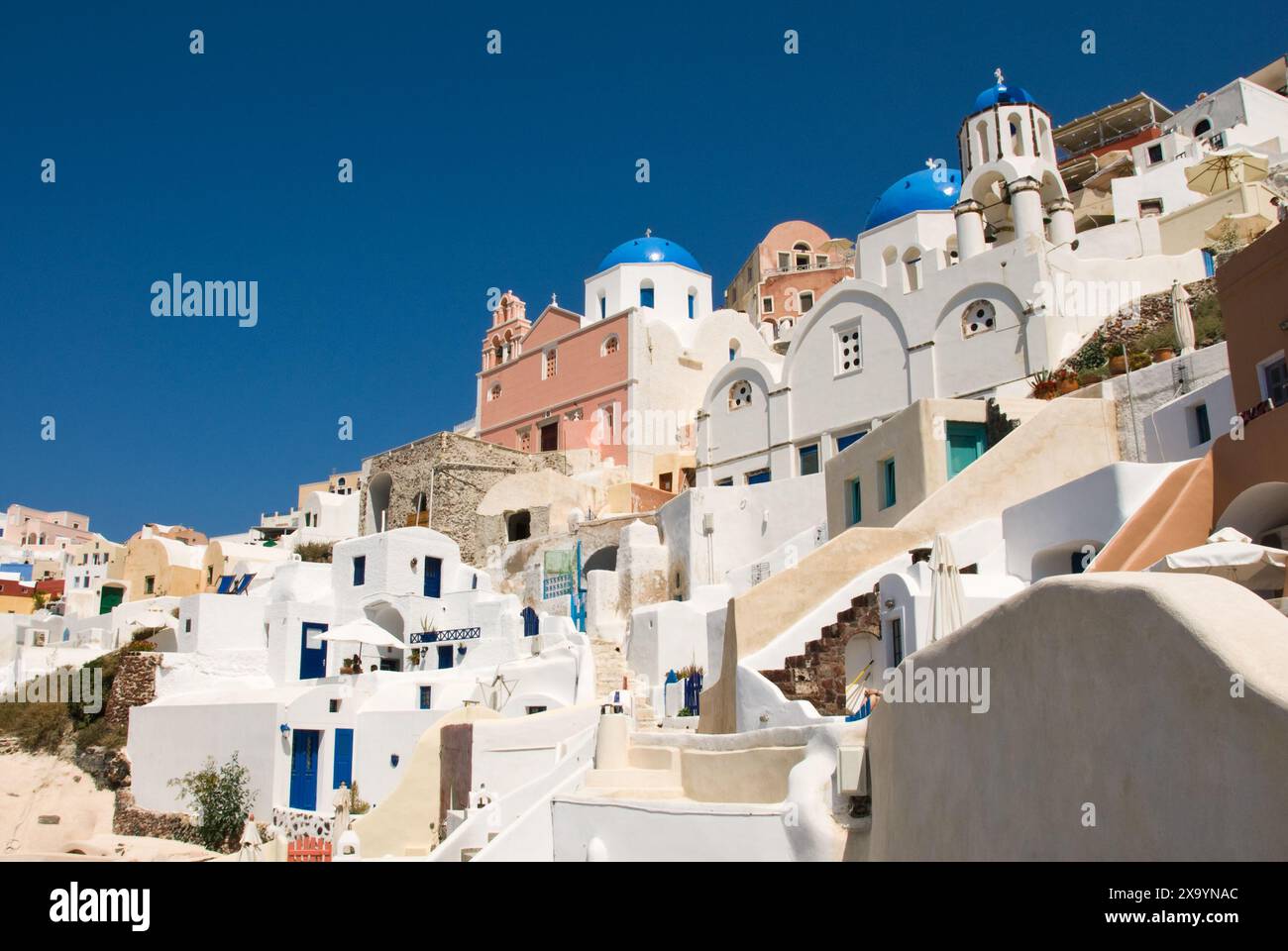 A scenic view of Oia cityscape with white buildings in Greece Stock ...