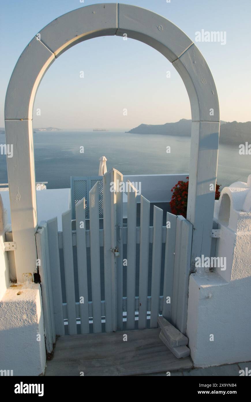A breathtaking view through a gate in Oia, Greece Stock Photo - Alamy