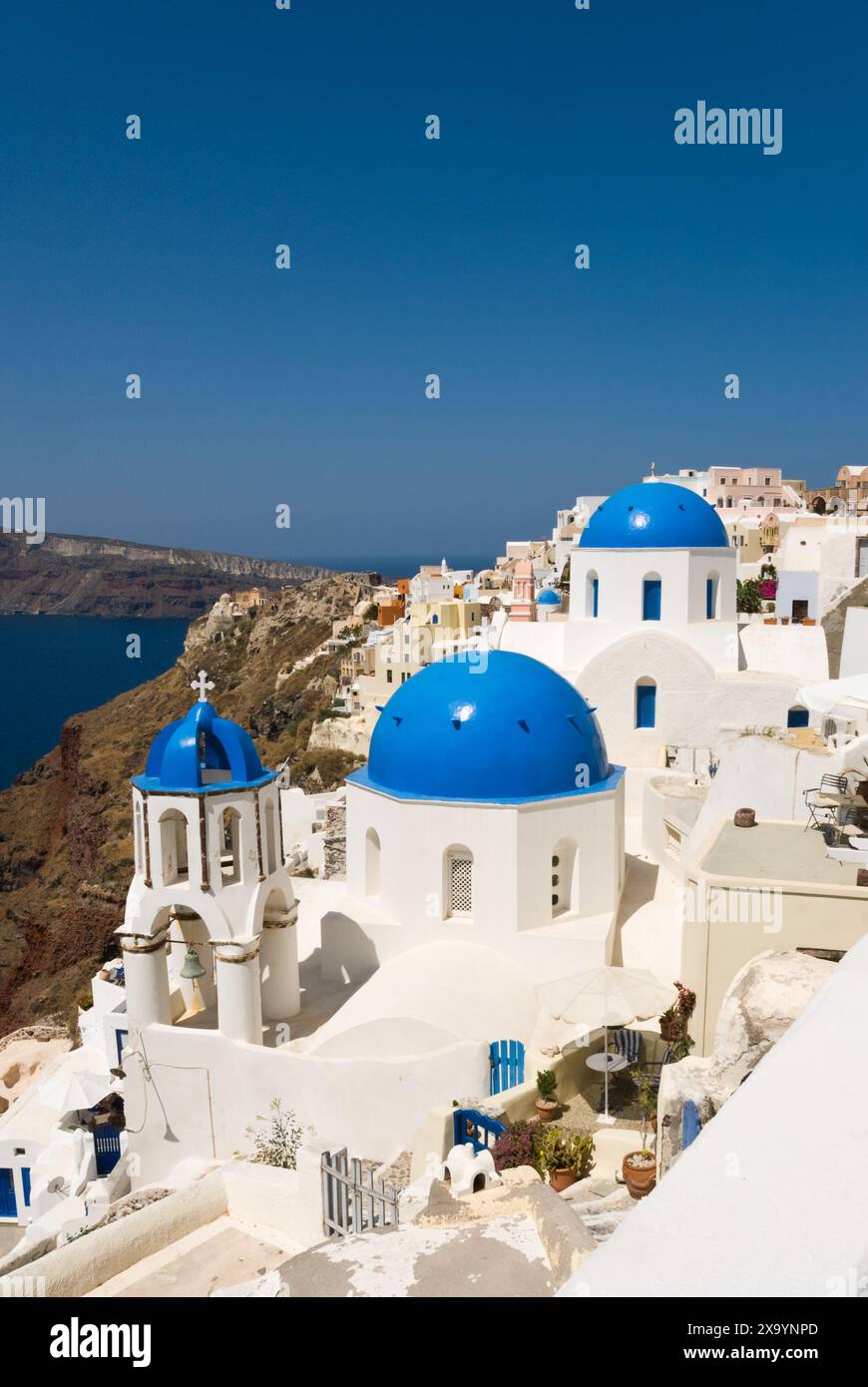 A scenic view of white and blue buildings in Oia, Greece Stock Photo ...