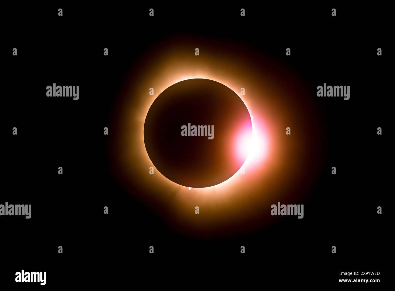A solar eclipse featuring a diamond ring effect and baileys beads Stock ...