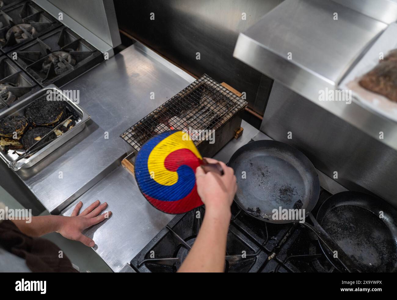 A top view of a person cooking in a kitchen Stock Photo - Alamy
