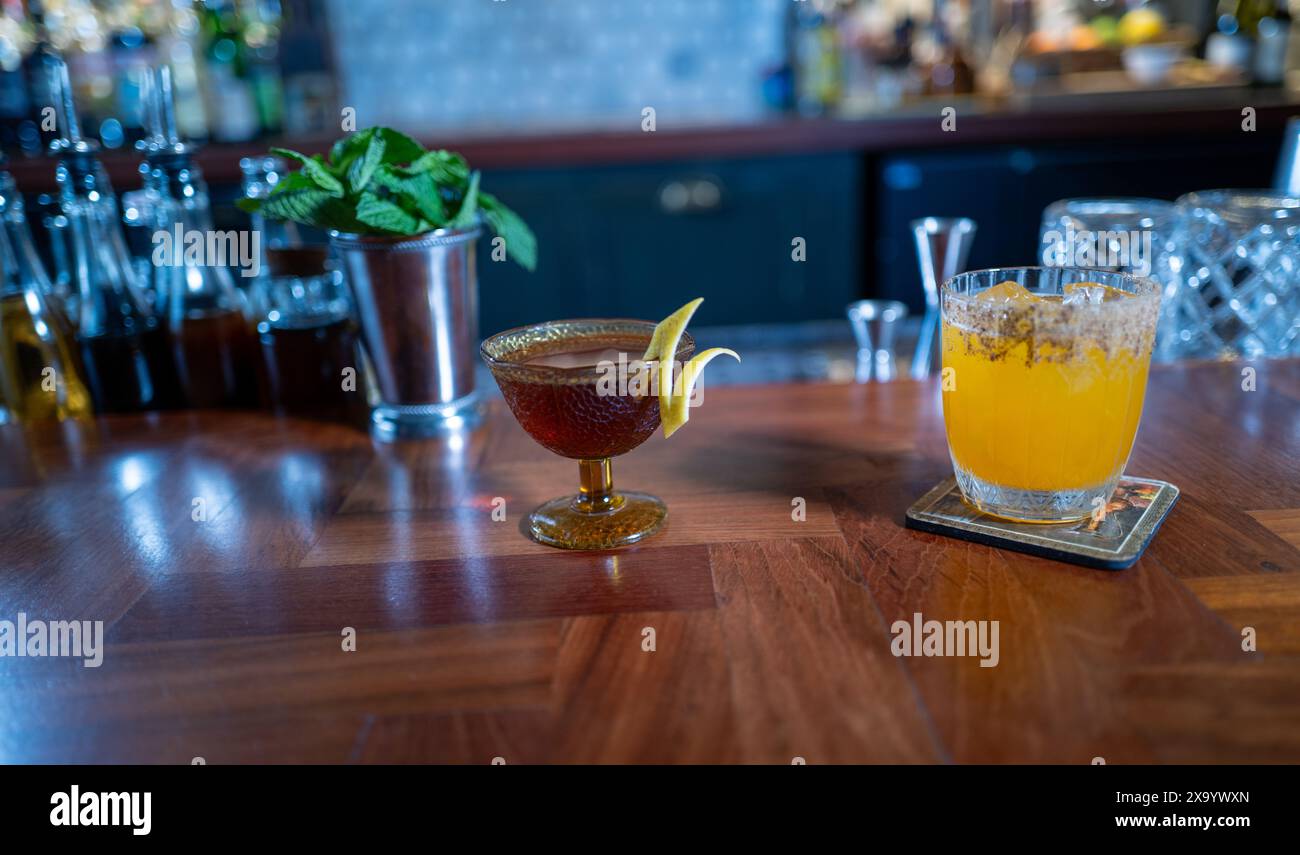 A bar table with assorted cocktails in a trendy bar setting Stock Photo ...
