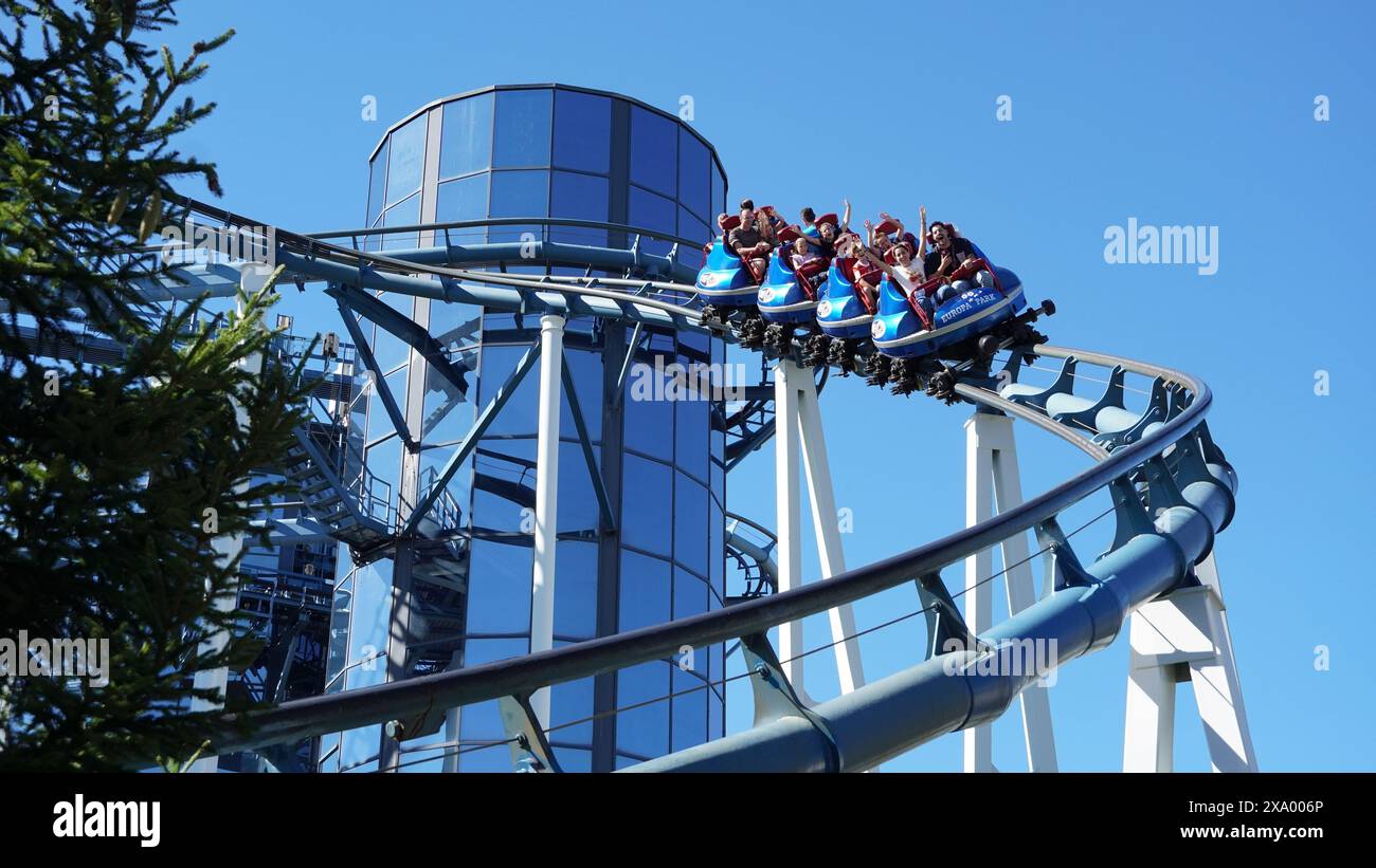 Young people have fun on the Euro-Mir spinning roller coaster at Europa ...