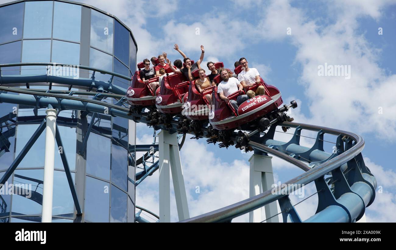 Young people have fun on the Euro-Mir spinning roller coaster at Europa ...