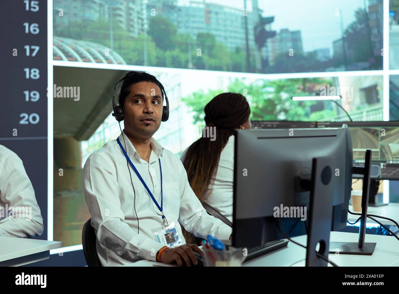 Indian employee following real time traffic activity on CCTV system ...