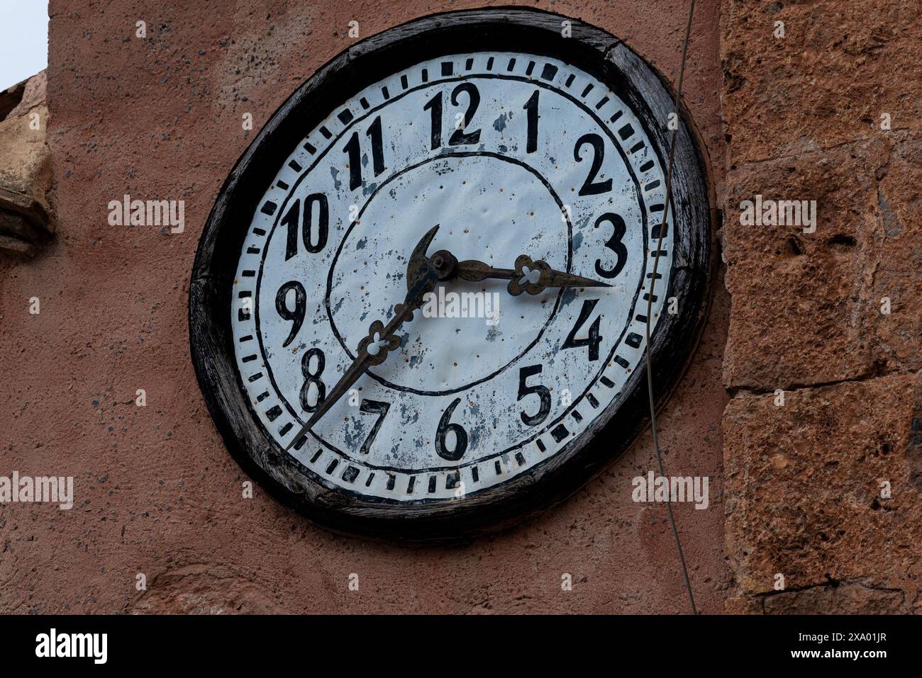 Antique Church Clock: Stone Facade Timepiece.An antique clock adorns ...