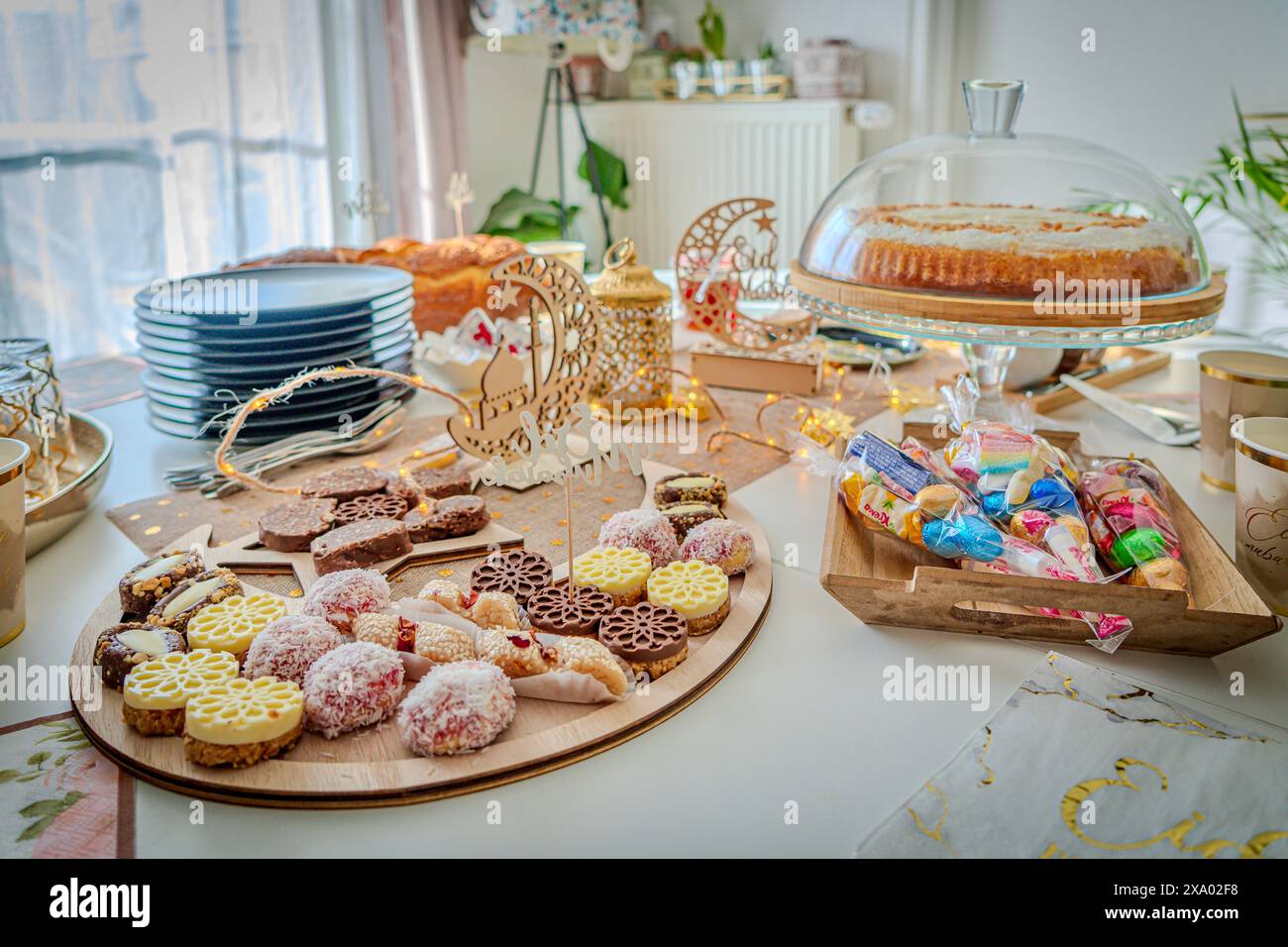 A variety of food laid out on a table for the Aid Mubarak celebration ...