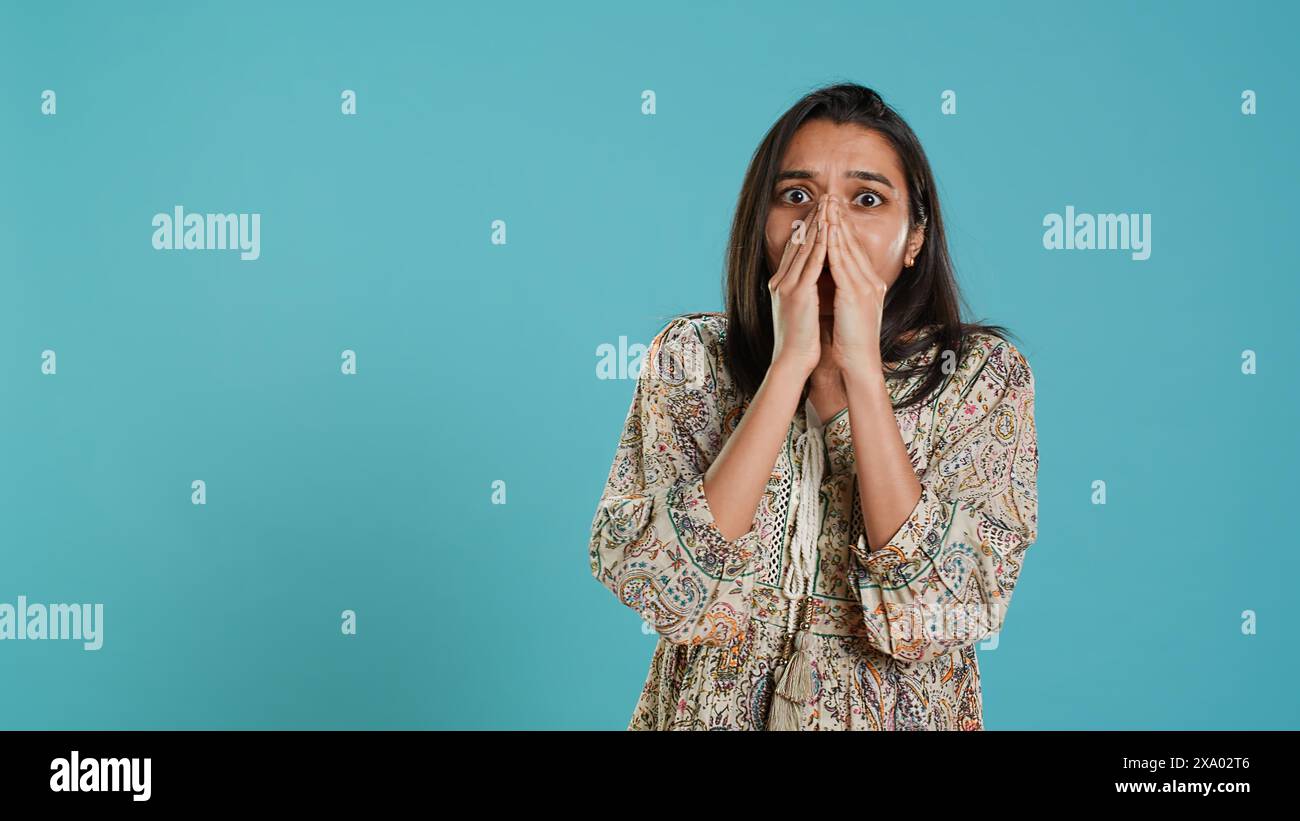 Anxious indian woman covering face with palms, worried about future ...