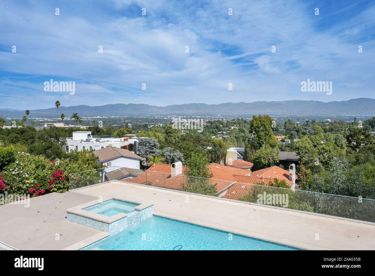 A backyard pool with mountain view in Encino, California Stock Photo ...