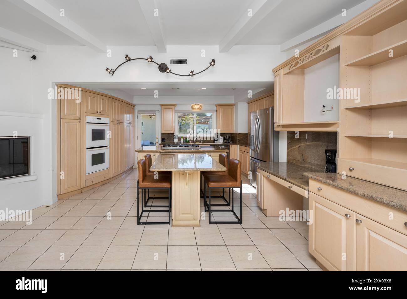 A modern and organized kitchen with ample cabinets Stock Photo - Alamy