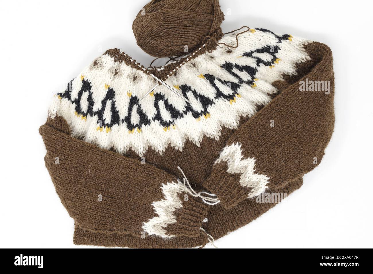 Flat lay photography of a brown, white, black Icelandic wool knitted ...