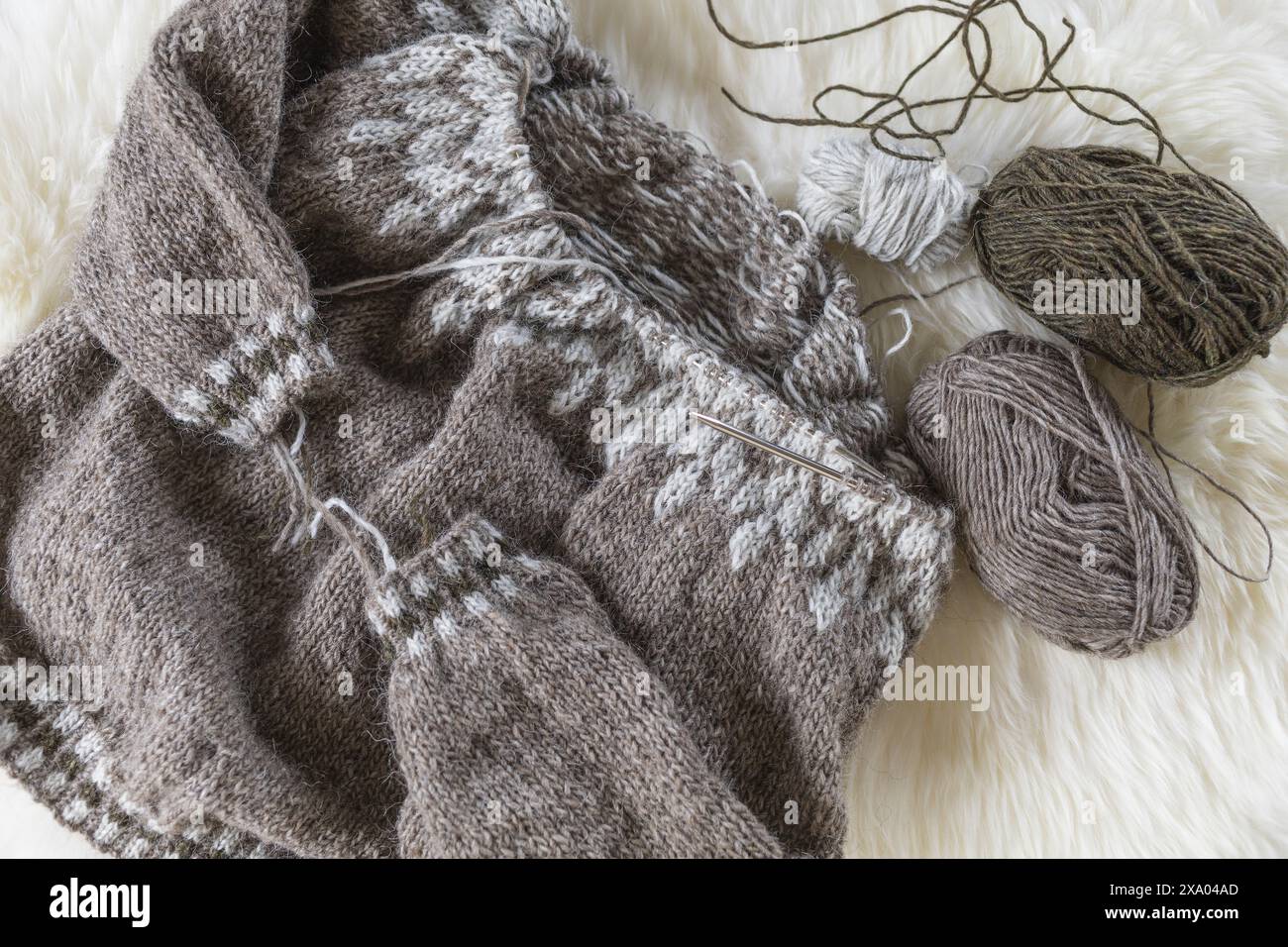 Flat lay photography of a beige Icelandic wool knitted lopapeysa ...