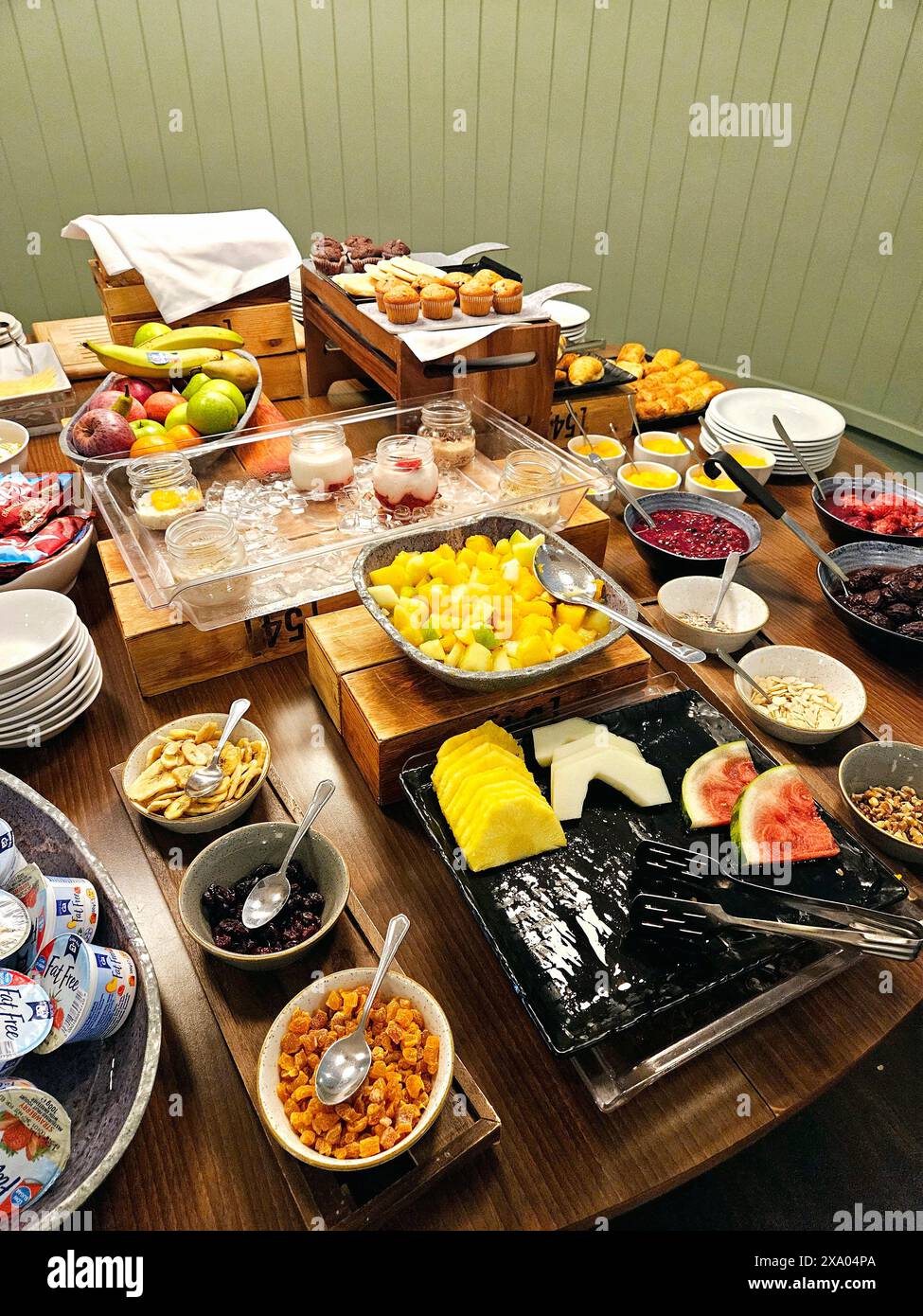 Table full of assorted plates and bowls of food Stock Photo - Alamy