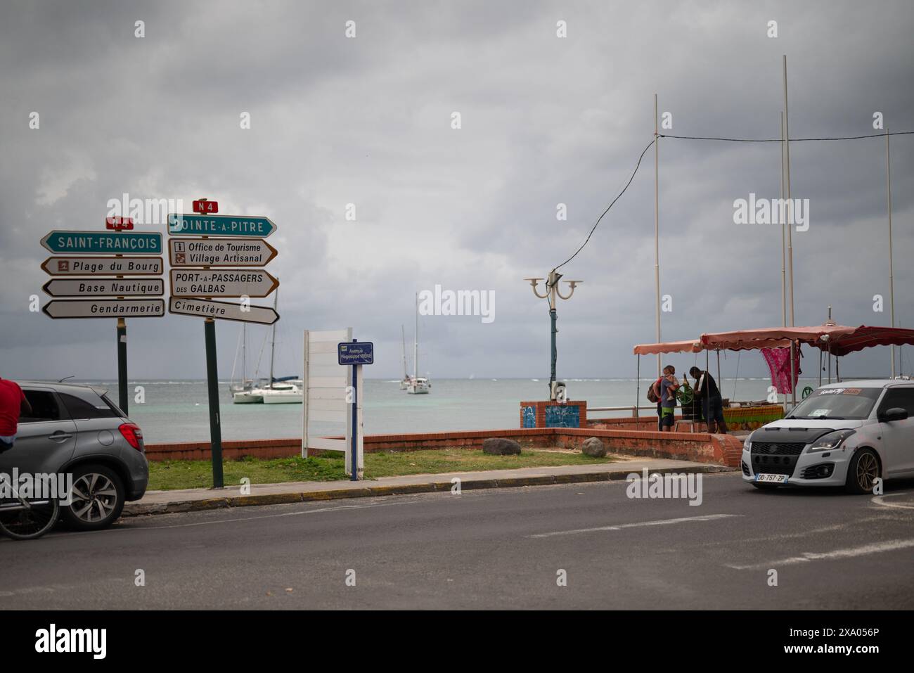 Cars parked by beach with ocean signs Stock Photo - Alamy