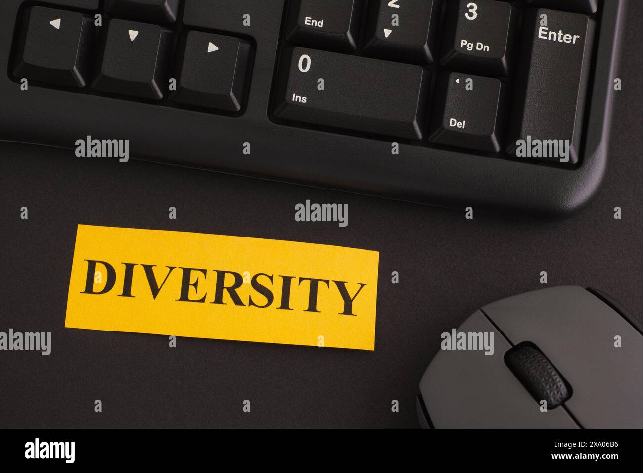 Diversity. Paper note with writing Diversity on a desk with black ...