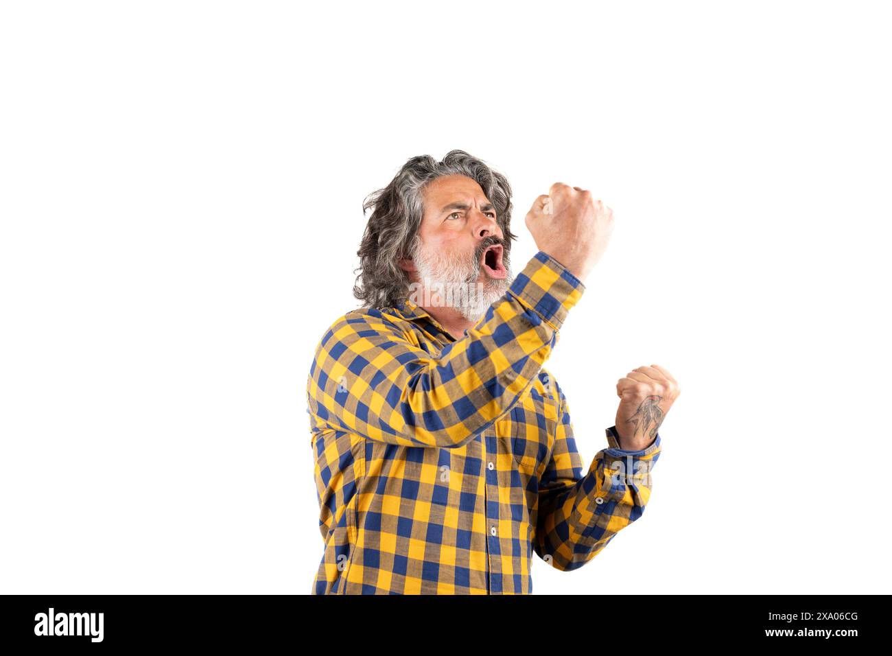 A middle-aged angry man shouting and gesturing with raised hands Stock ...