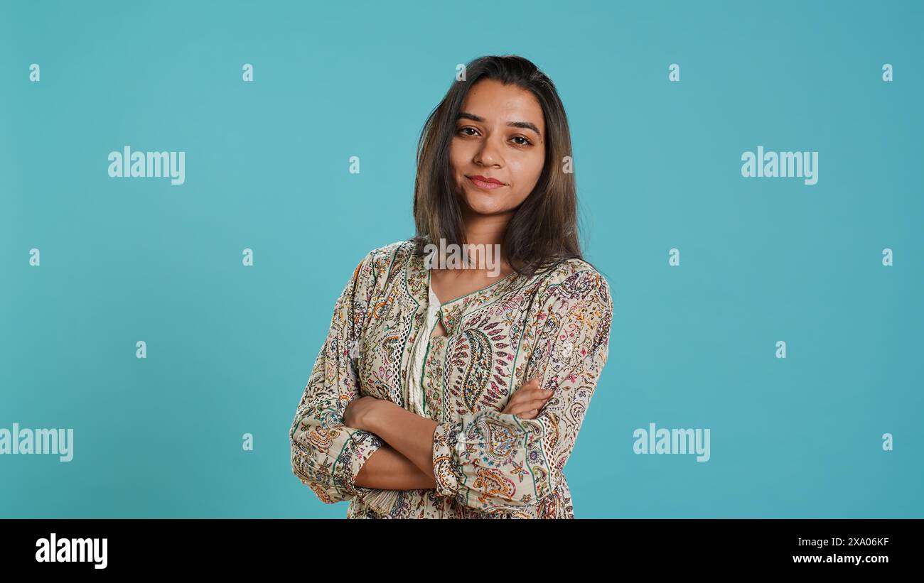Portrait of cheerful friendly indian woman smiling, looking pleased ...