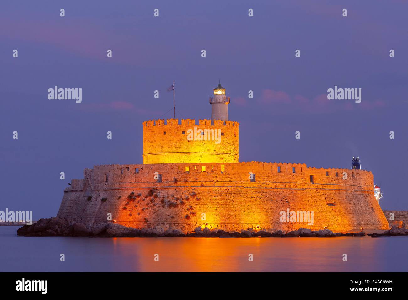 The Fort of St Nicholas illuminated at night in Rhodes, Greece Stock ...
