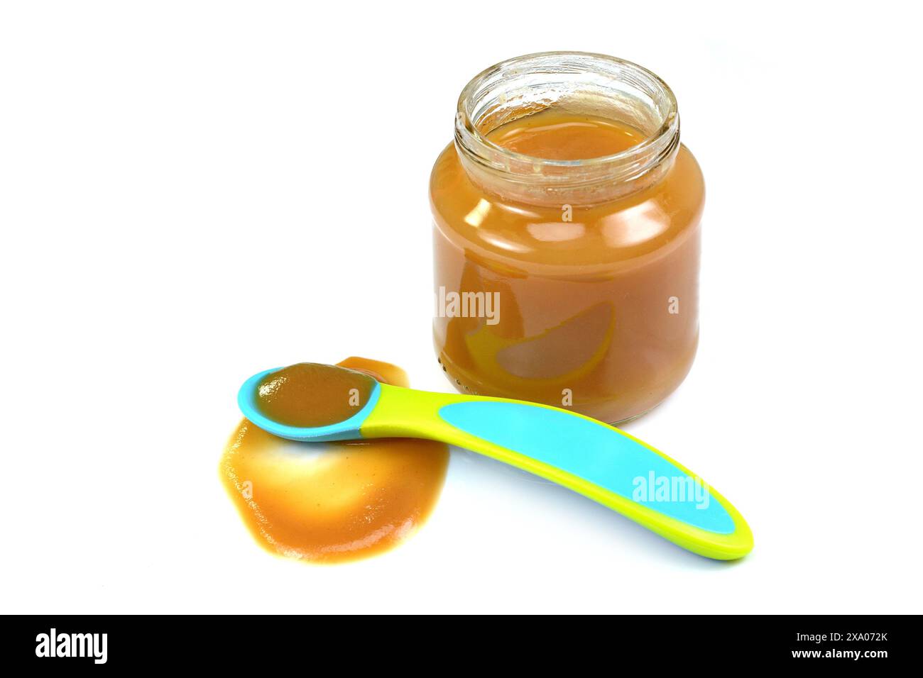 Baby fruit puree jar and spoon isolated on white Stock Photo - Alamy