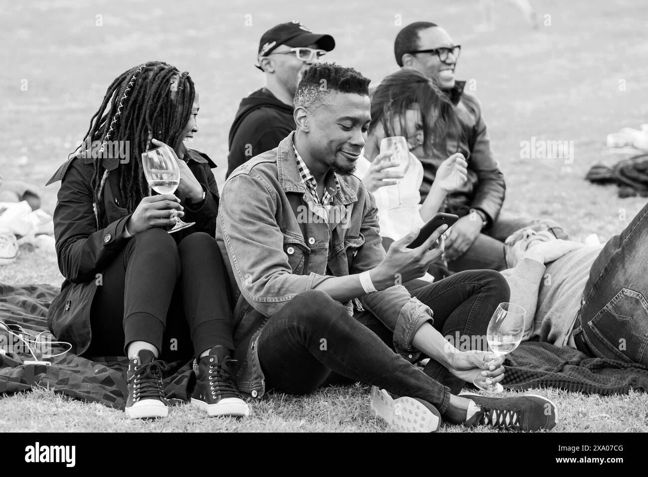 A group of people having a good time in the countryside in grayscale ...