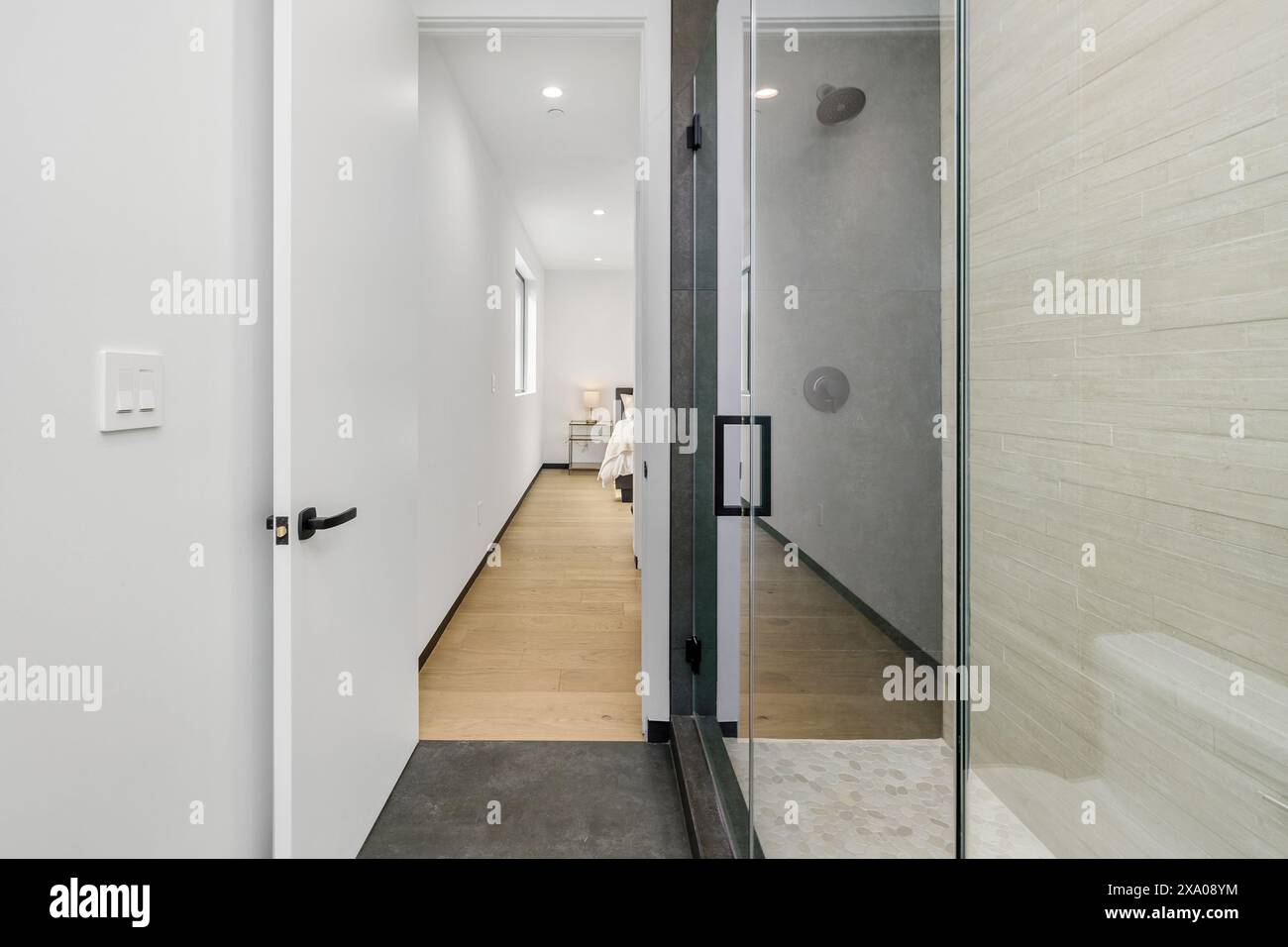 A door in a hallway opens to an outdoor seating area Stock Photo - Alamy