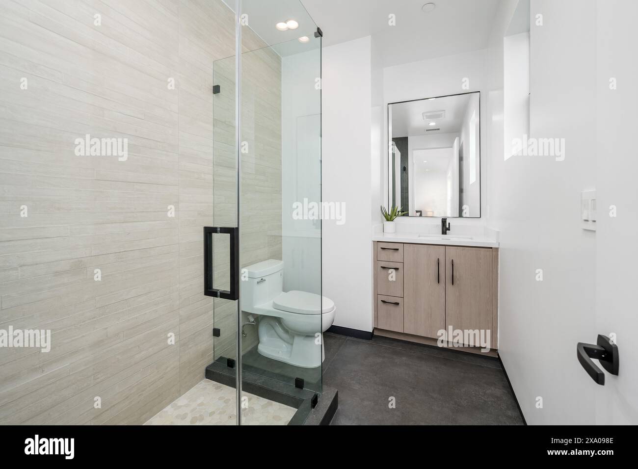 Modern bathroom with glass walls and spacious walk-in shower Stock ...