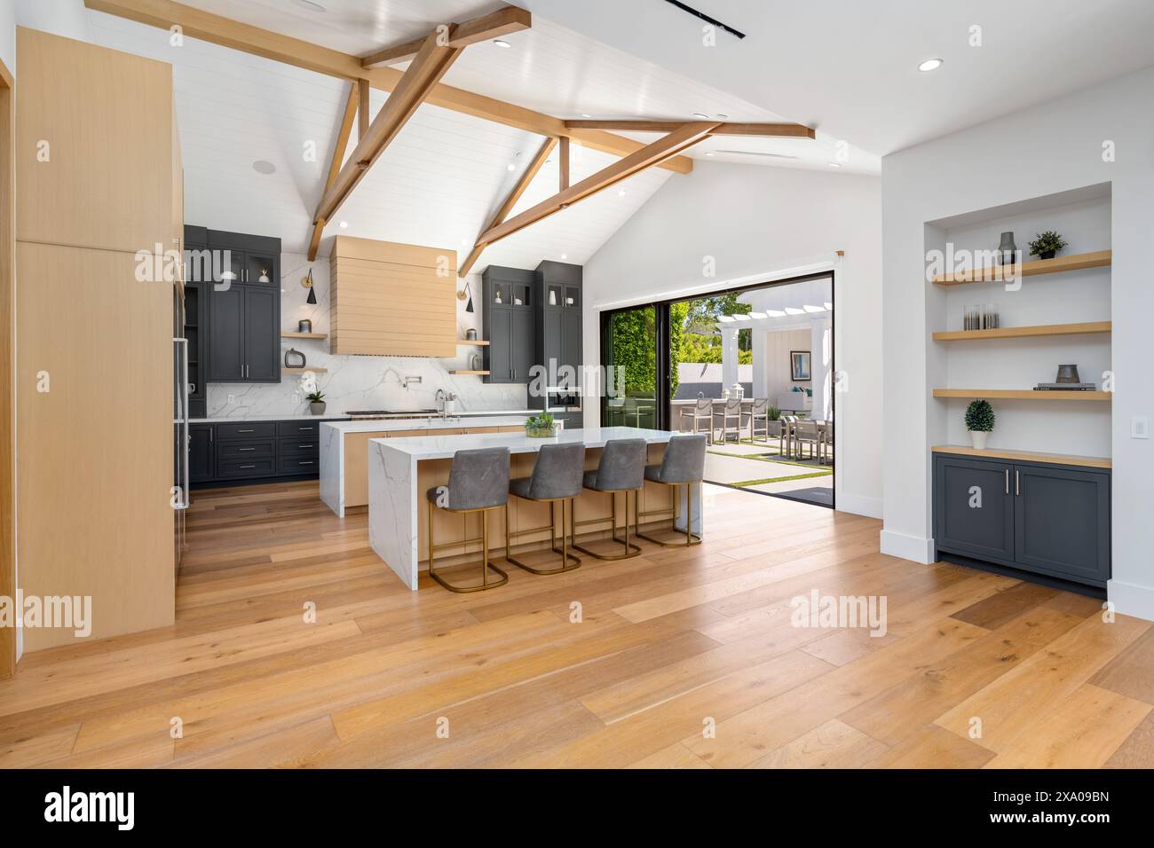 A roomy kitchen with open layout and ample storage space Stock Photo ...