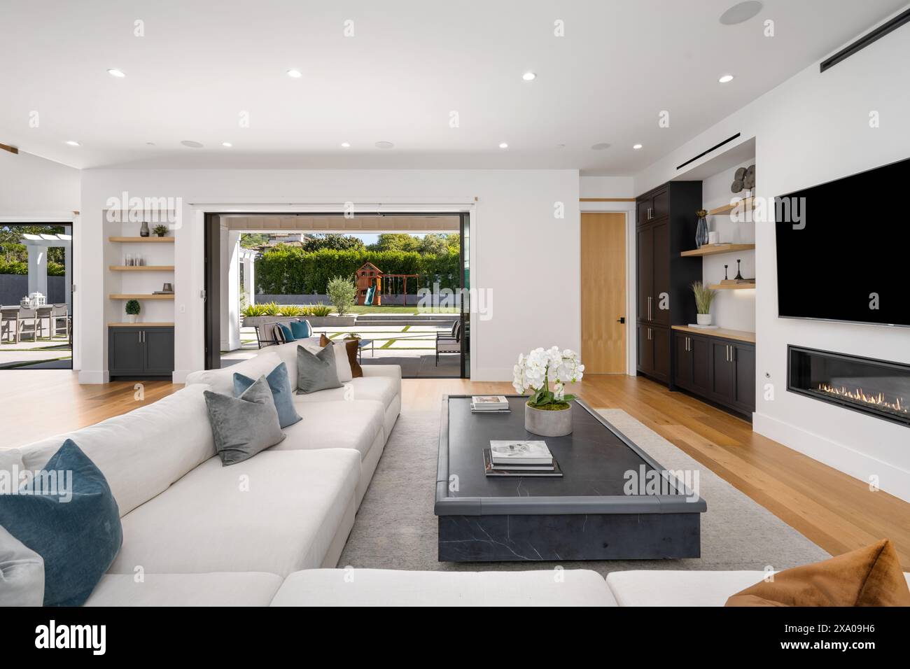 White sofa beside black coffee table in modern living room Stock Photo ...