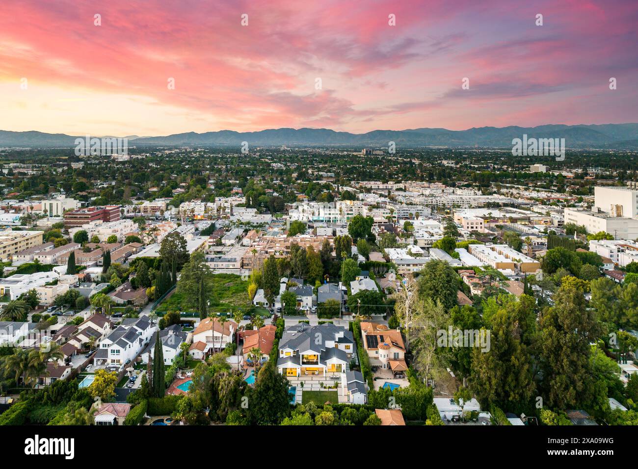 Scenic cityscape with distant mountains and scattered houses Stock ...