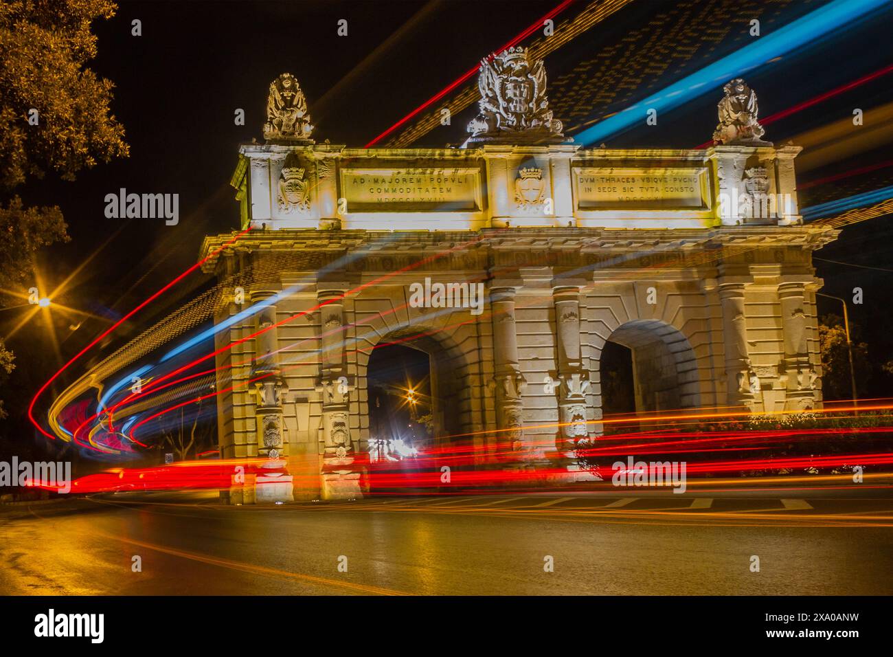Bombs Gate of Floriana, Malta by Night with car lights trails in color ...
