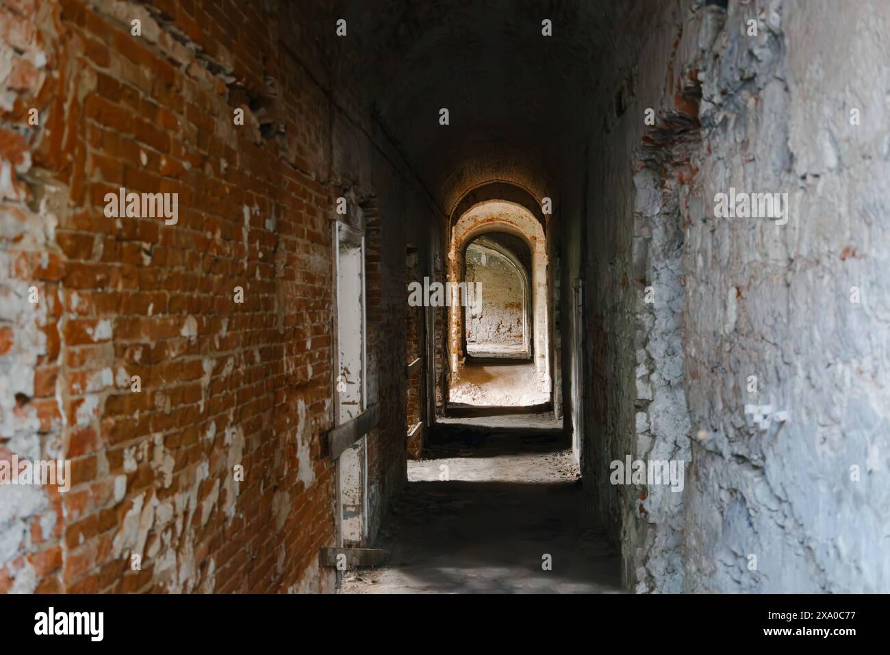 Indoor ruined brick premises with arches, doors and corridors. Old ...