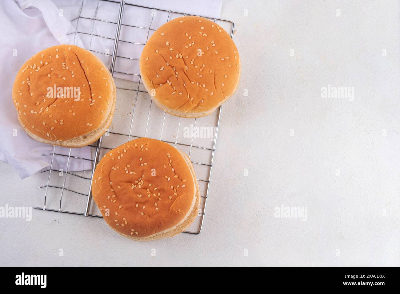 Homemade freshly baked burger buns. Traditional American sesame buns on ...