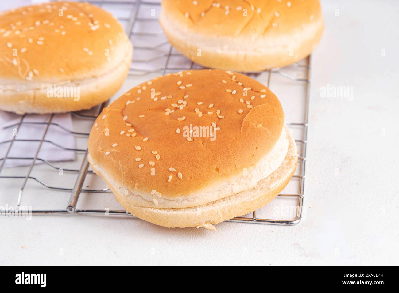 Homemade freshly baked burger buns. Traditional American sesame buns on ...