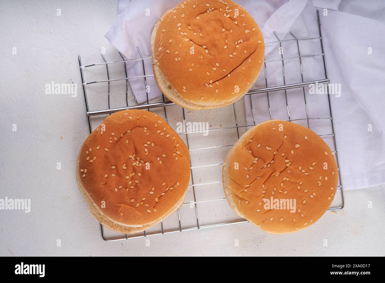 Homemade freshly baked burger buns. Traditional American sesame buns on ...
