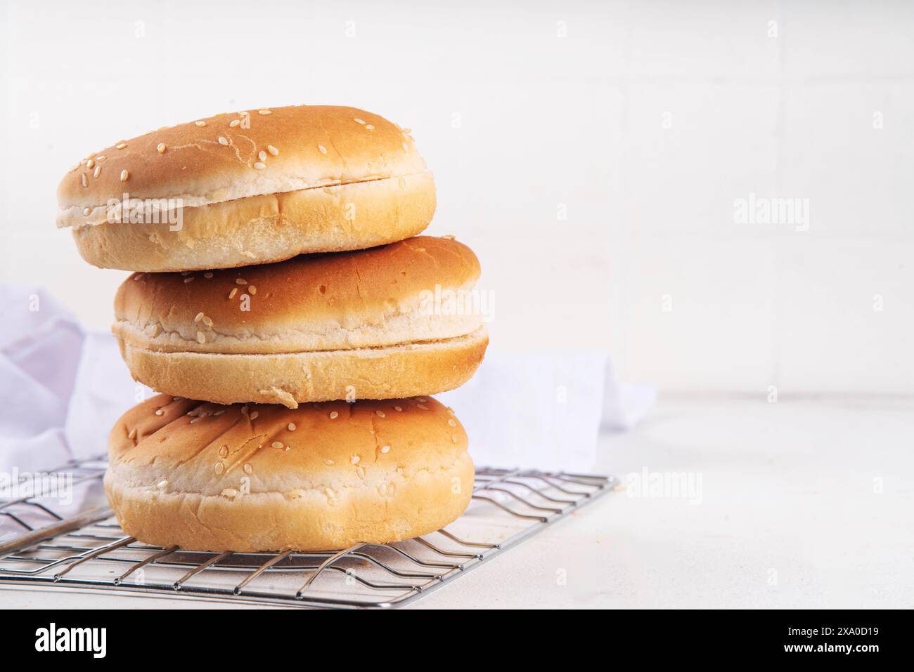 Homemade freshly baked burger buns. Traditional American sesame buns on ...